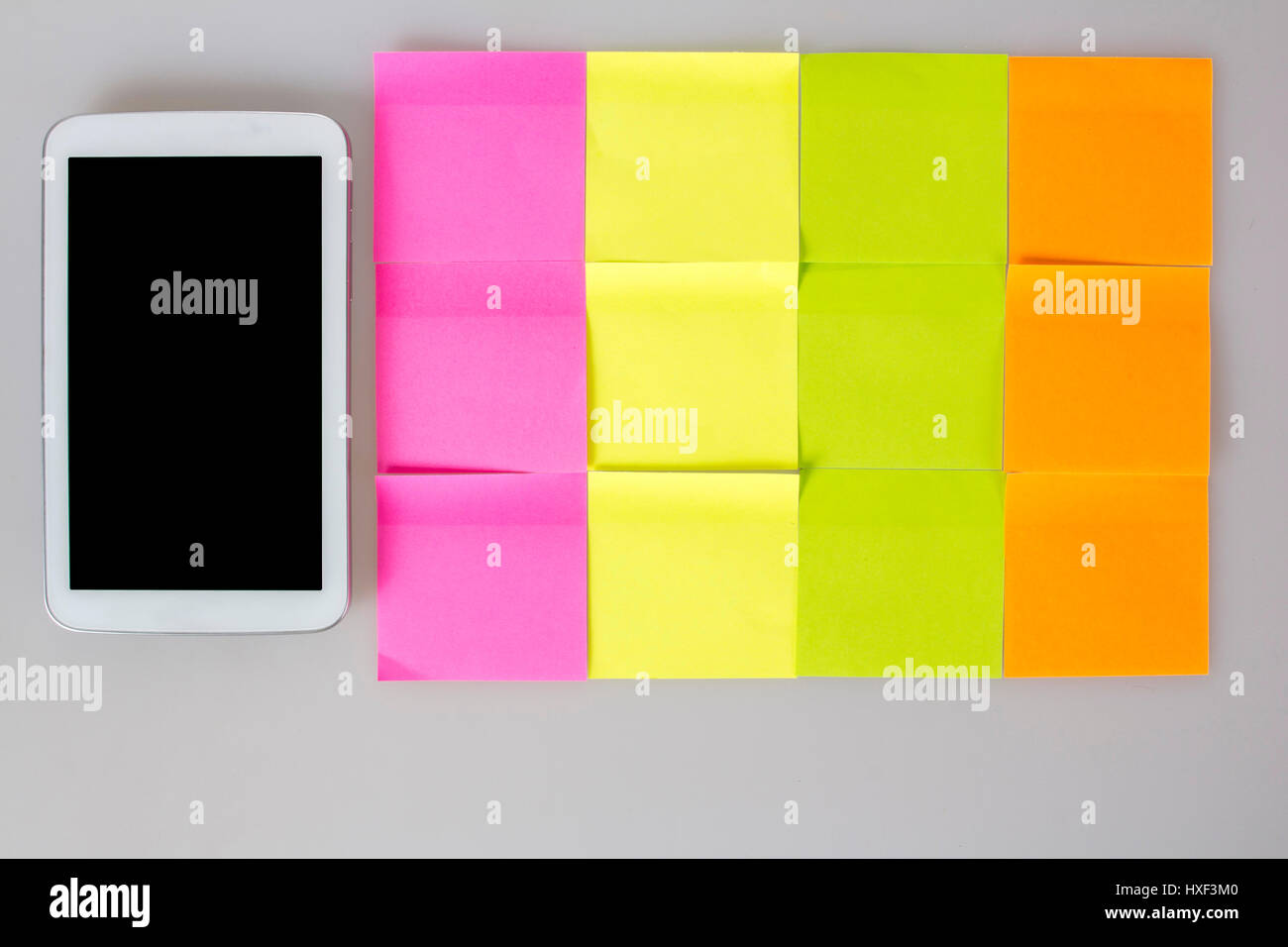 post it notes colorful blank next to mobile phone Stock Photo - Alamy