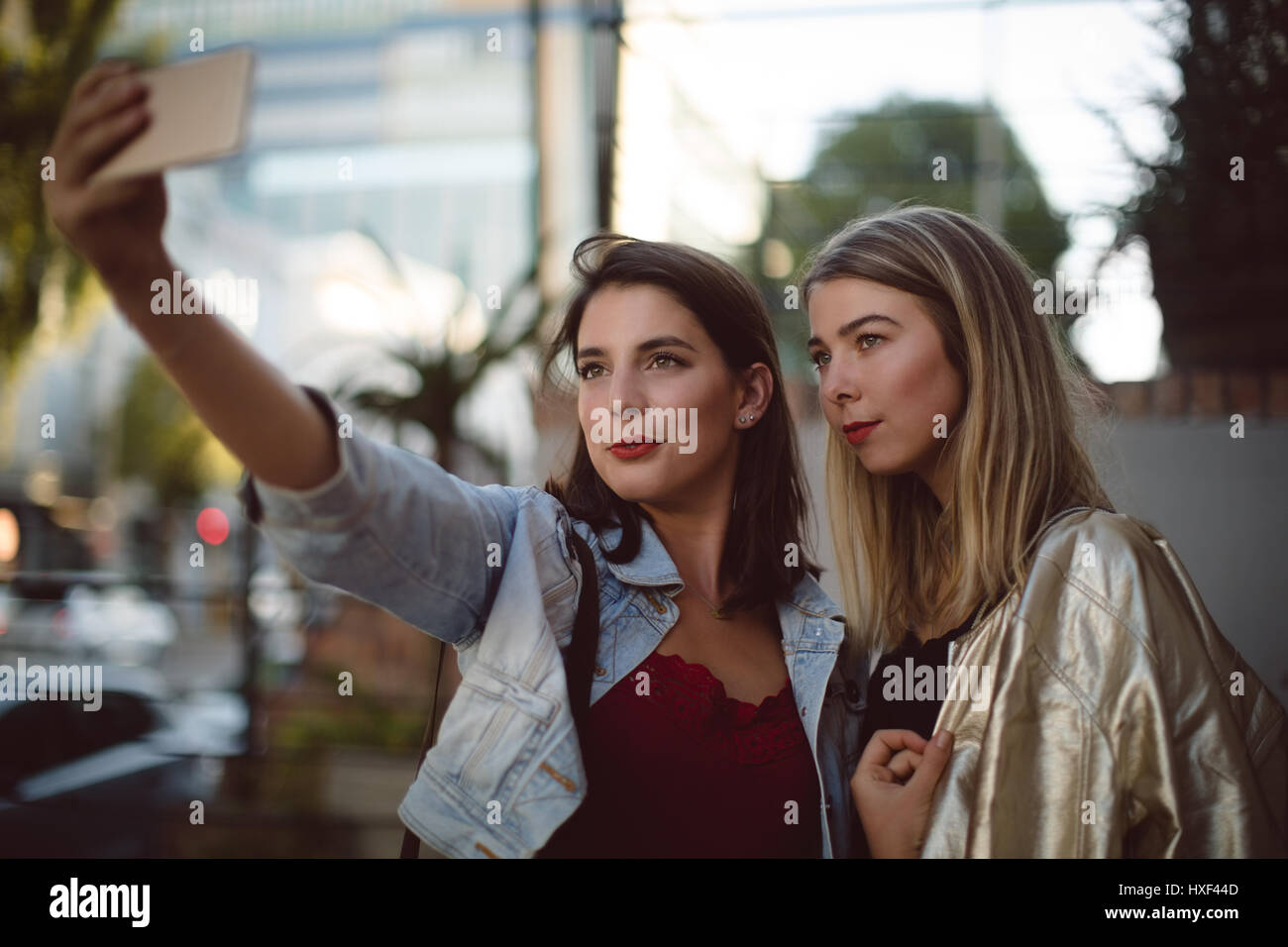 Happy young female friends pose hi-res stock photography and images - Alamy
