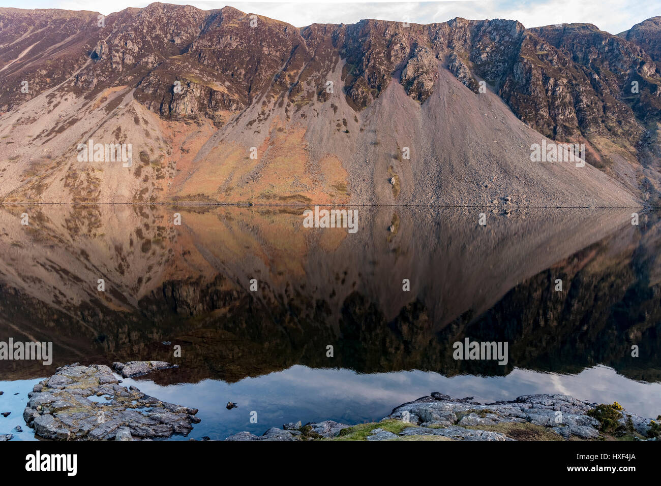 Wastwater with flat calm still water and paddleboarder Stock Photo - Alamy