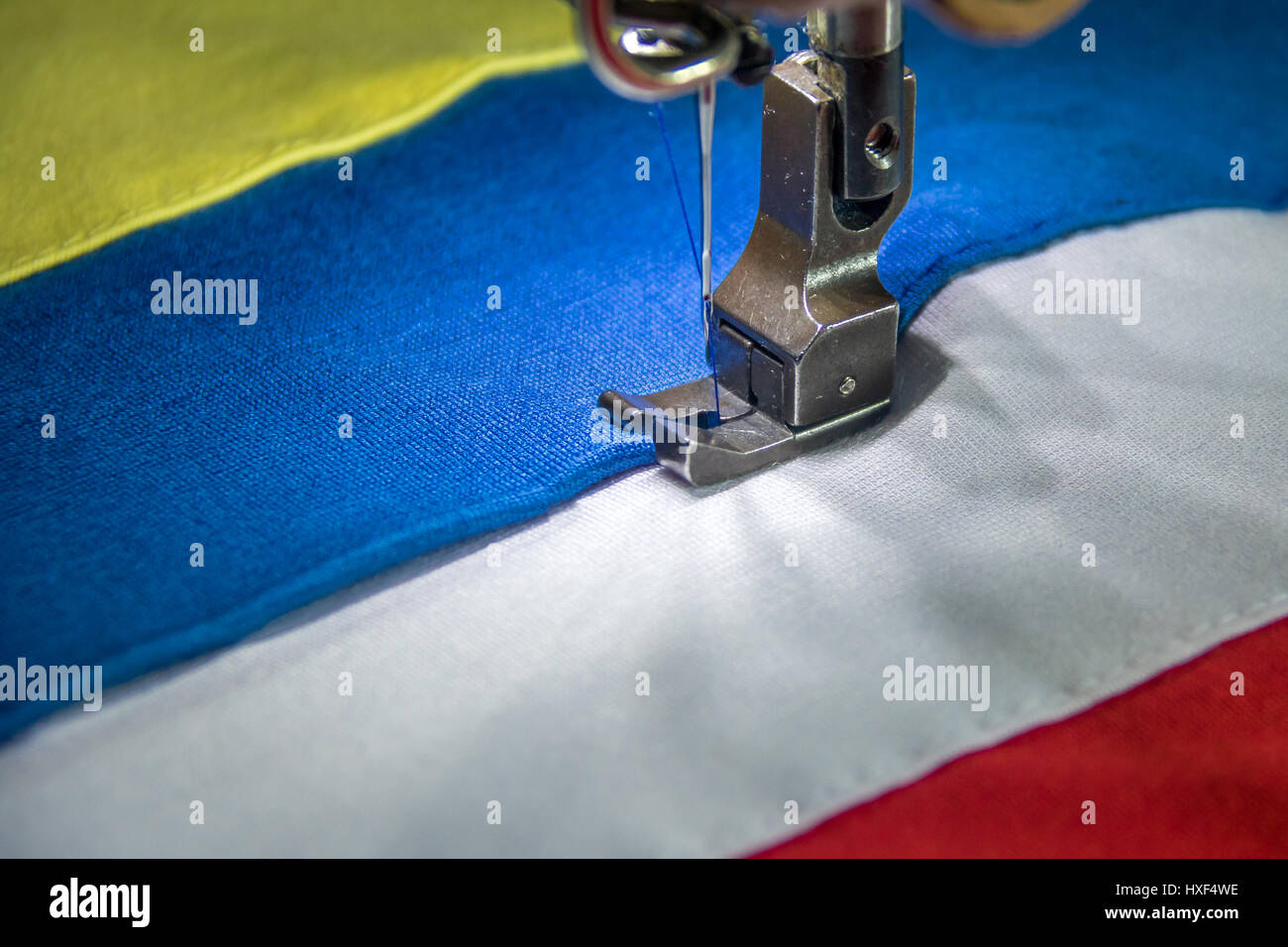 Professional sewing machine with four colors fabric Stock Photo - Alamy