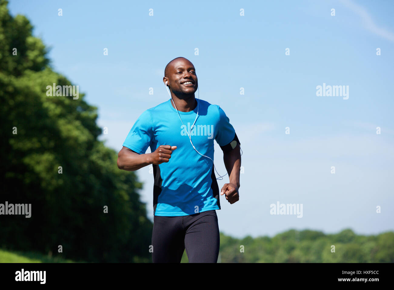 Portrait of an active african american man running exercise workout ...