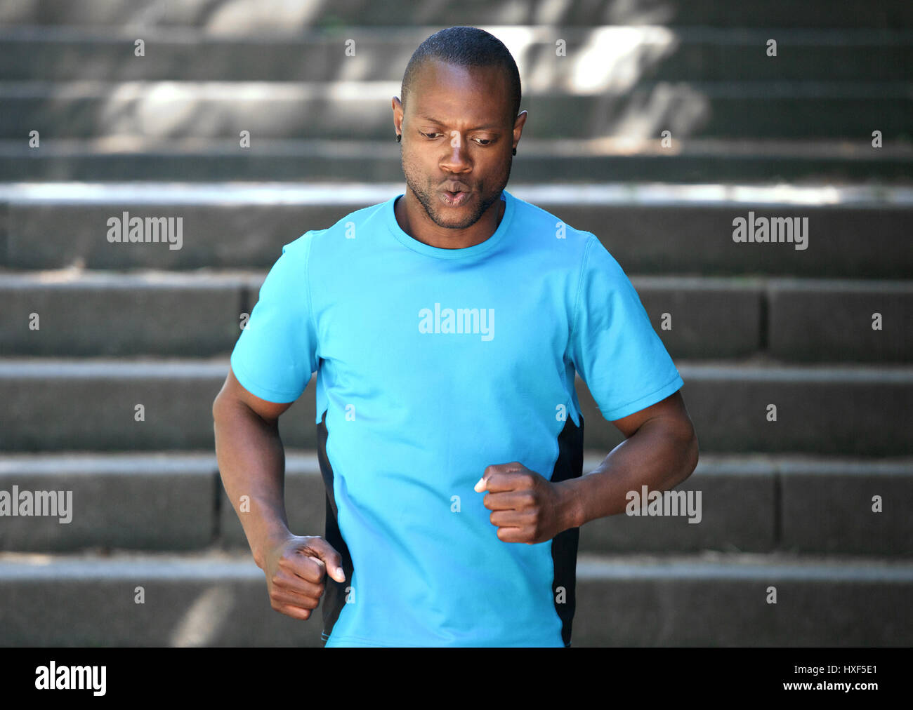 African american man running down stairs keeping fit Stock Photo - Alamy
