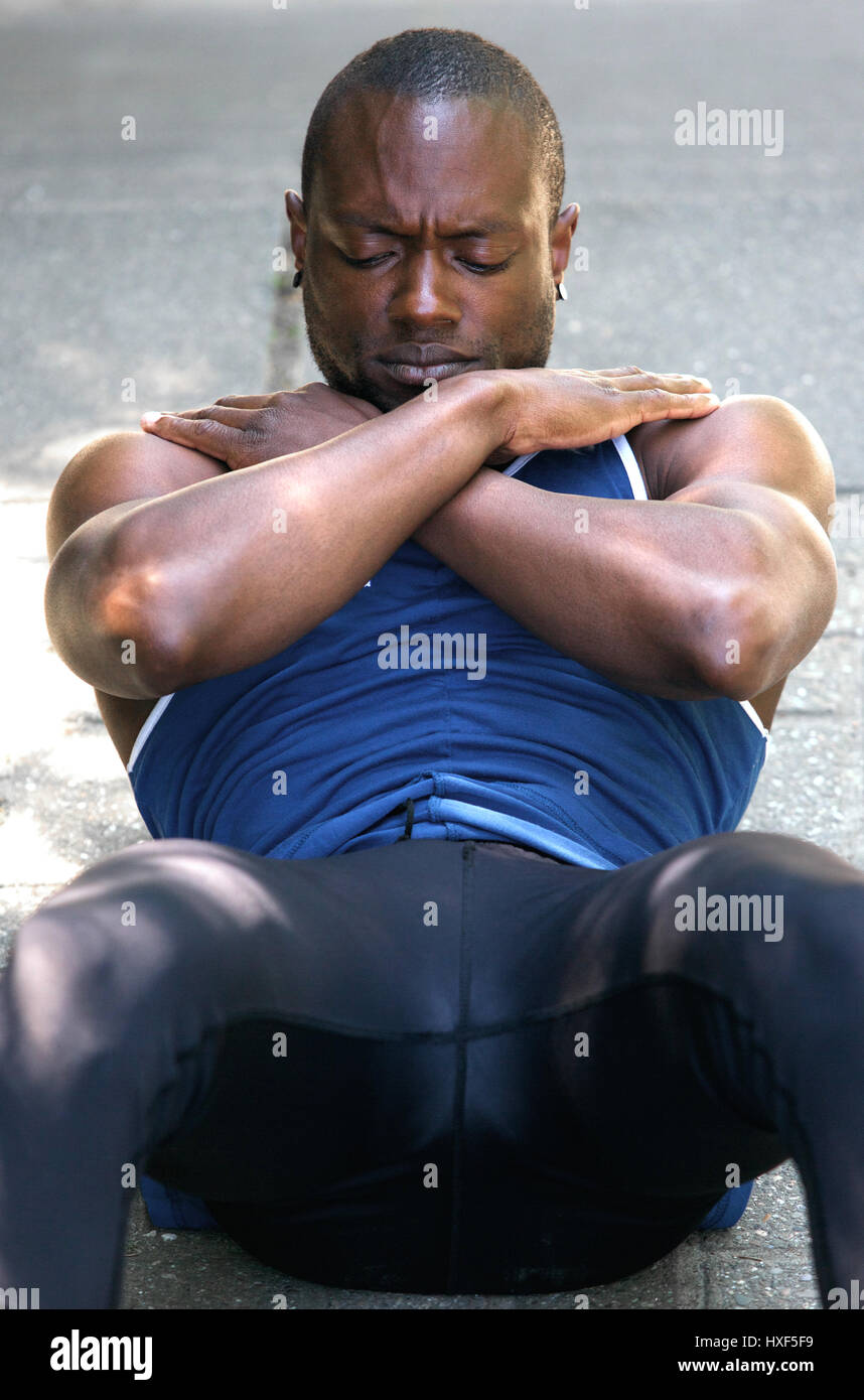 Portrait of a sporty man stomach crunch exercise Stock Photo - Alamy