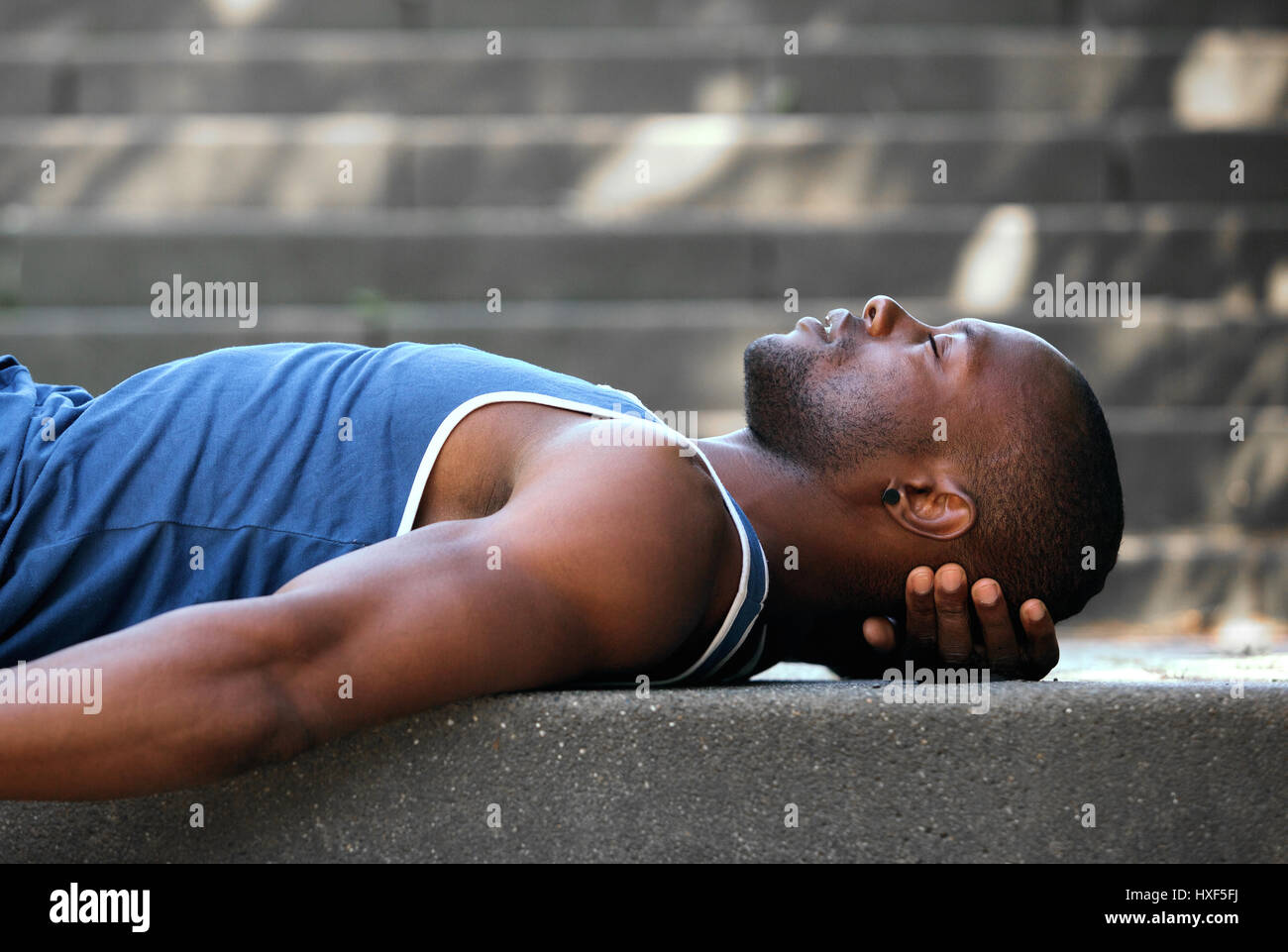 Side portrait of an african american man sleeping outside Stock Photo ...