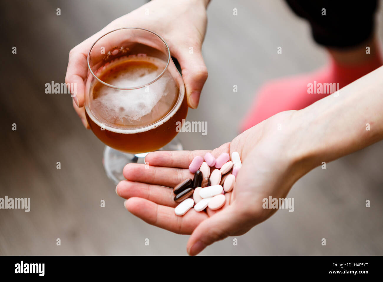 addict problem, woman with pills and beer in hands. drugs and narcotics ...