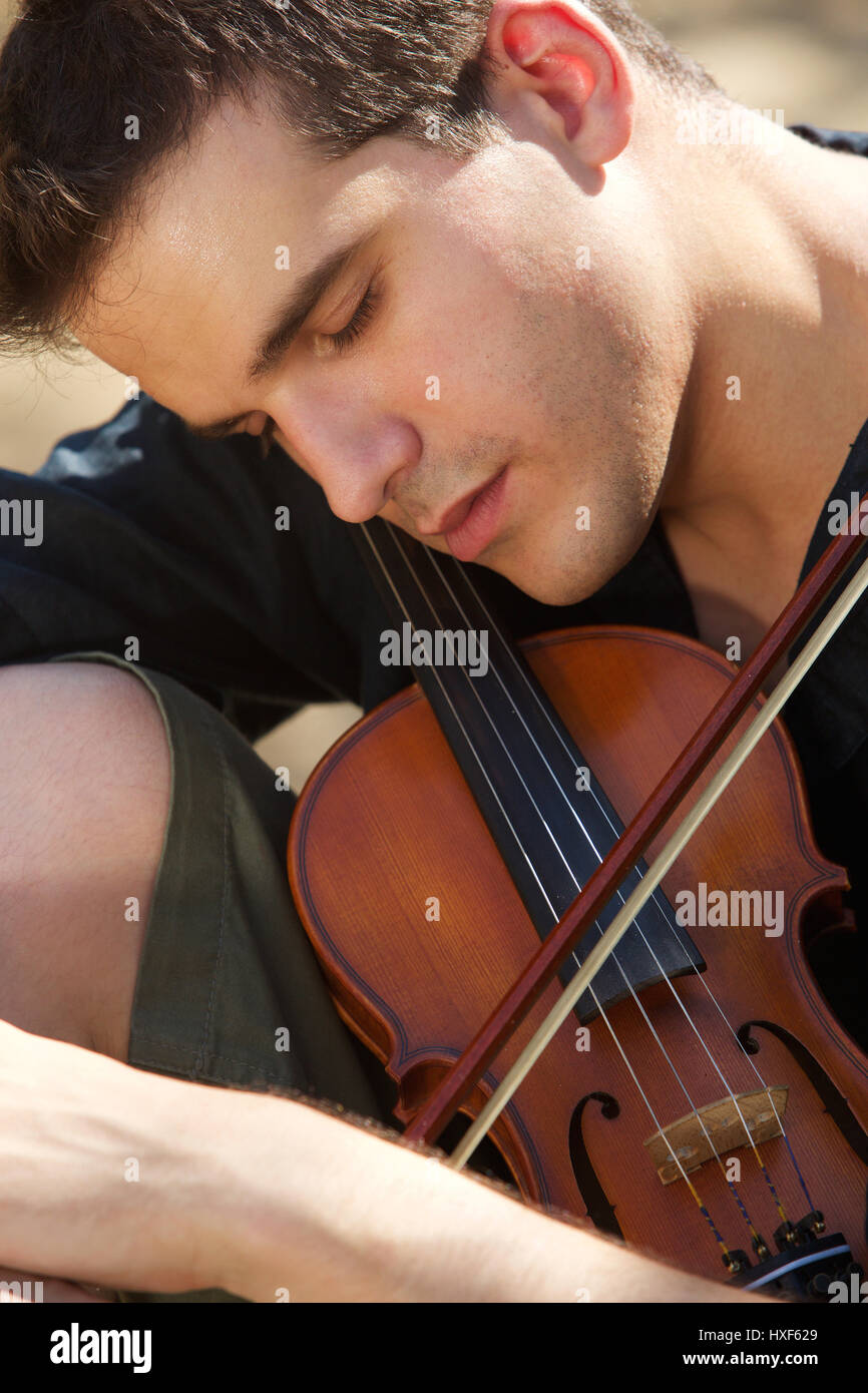 Portrait of a man sleeping with his violin Stock Photo - Alamy