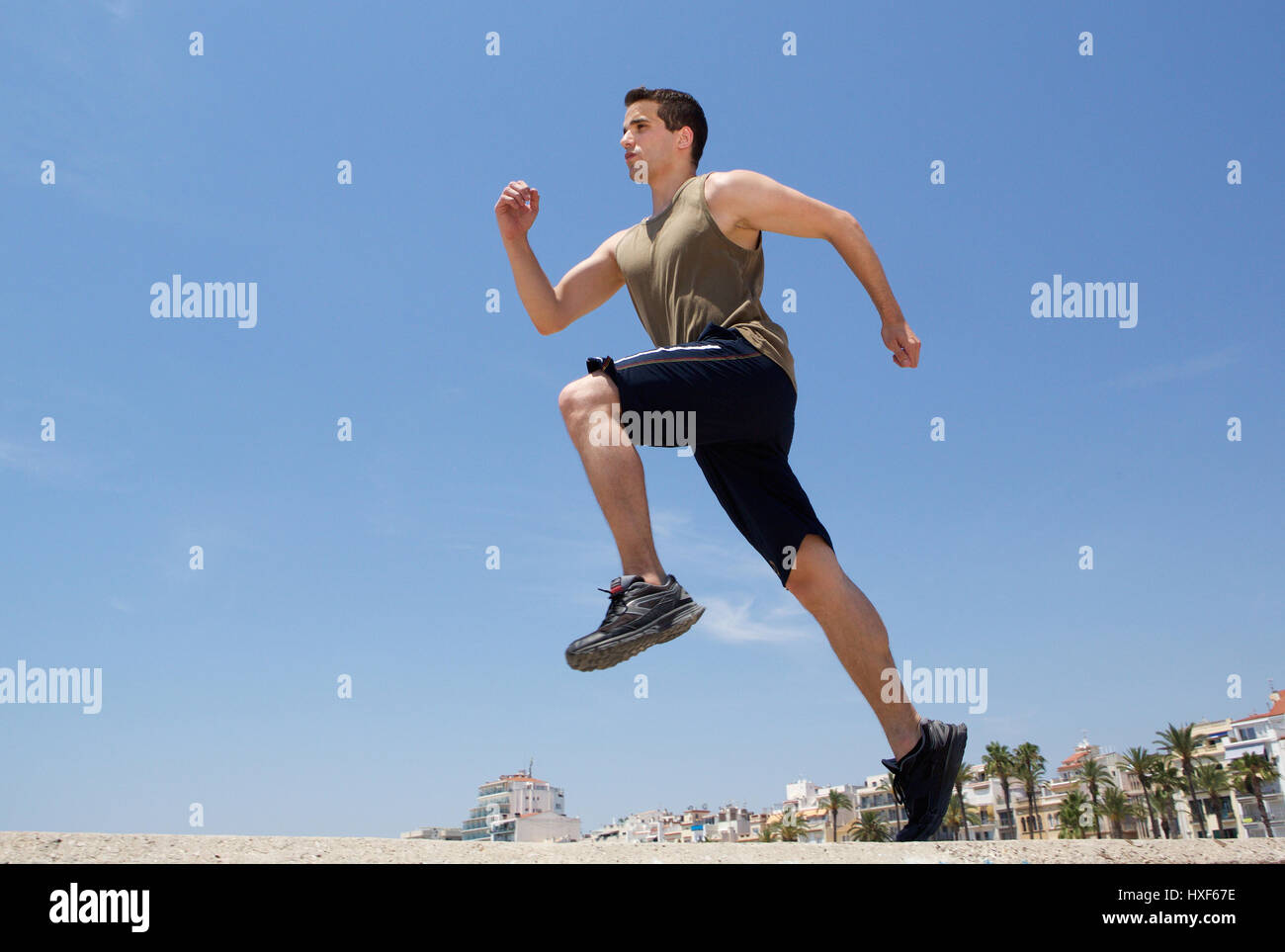 Active man running exercise workout outside in summer Stock Photo - Alamy