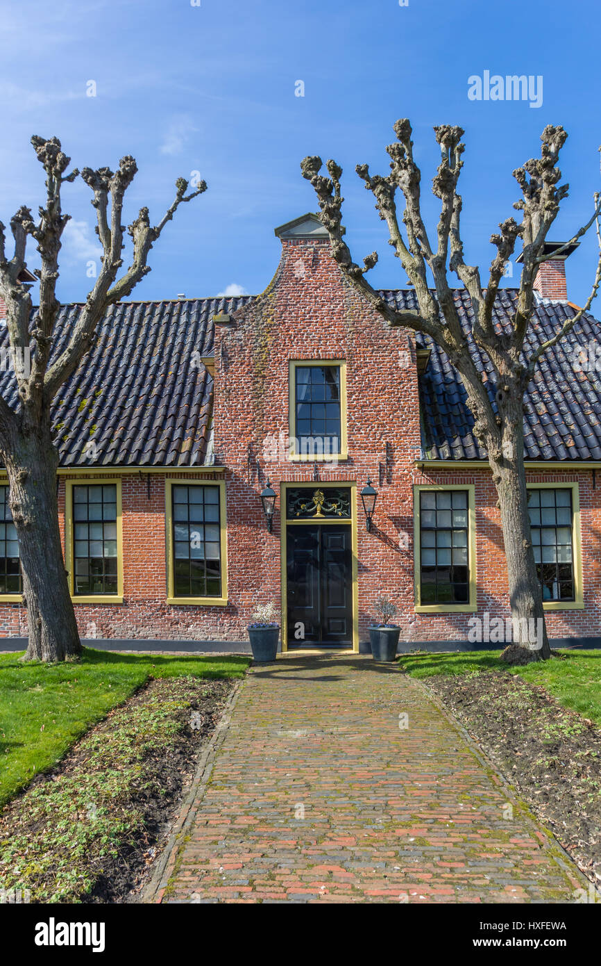 Old red brick house in the hisorical village of Aduard, Netherlands ...
