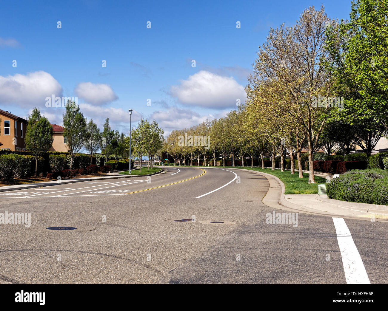 Curving Road and Sidewalk Stock Photo - Alamy