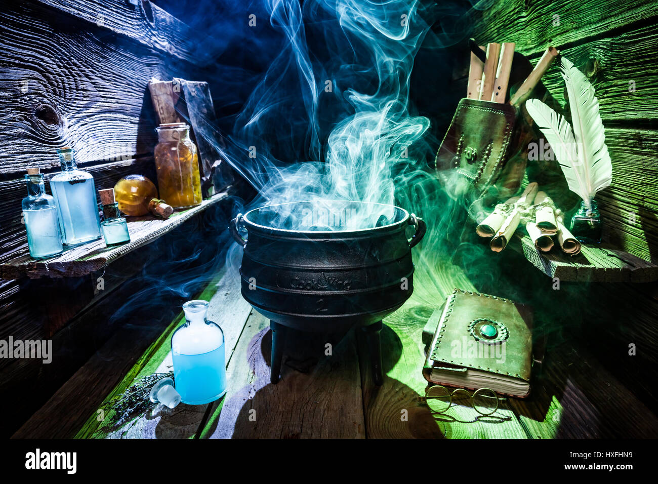 Magical witch workshop with blue and green smoke for Halloween Stock Photo - Alamy