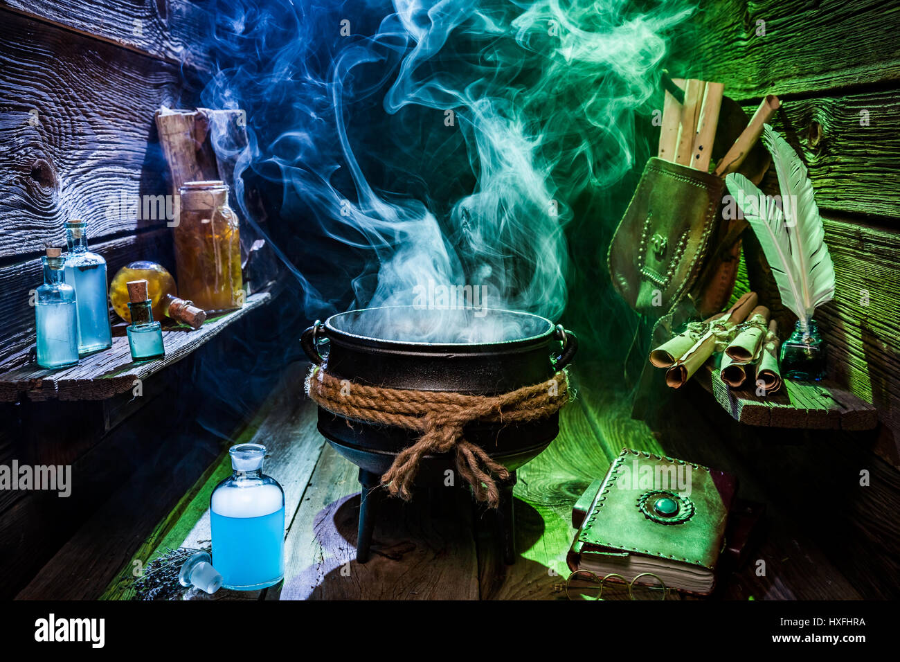 Vintage witch pot with blue and green smoke for Halloween Stock Photo ...