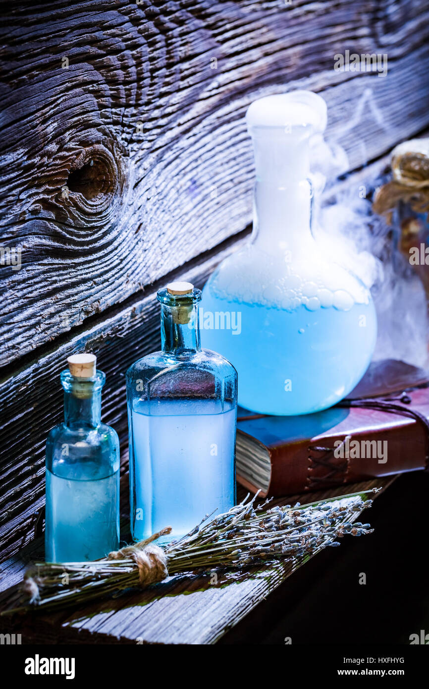 Magical potions with blue mixture in witch cottage for Halloween Stock ...