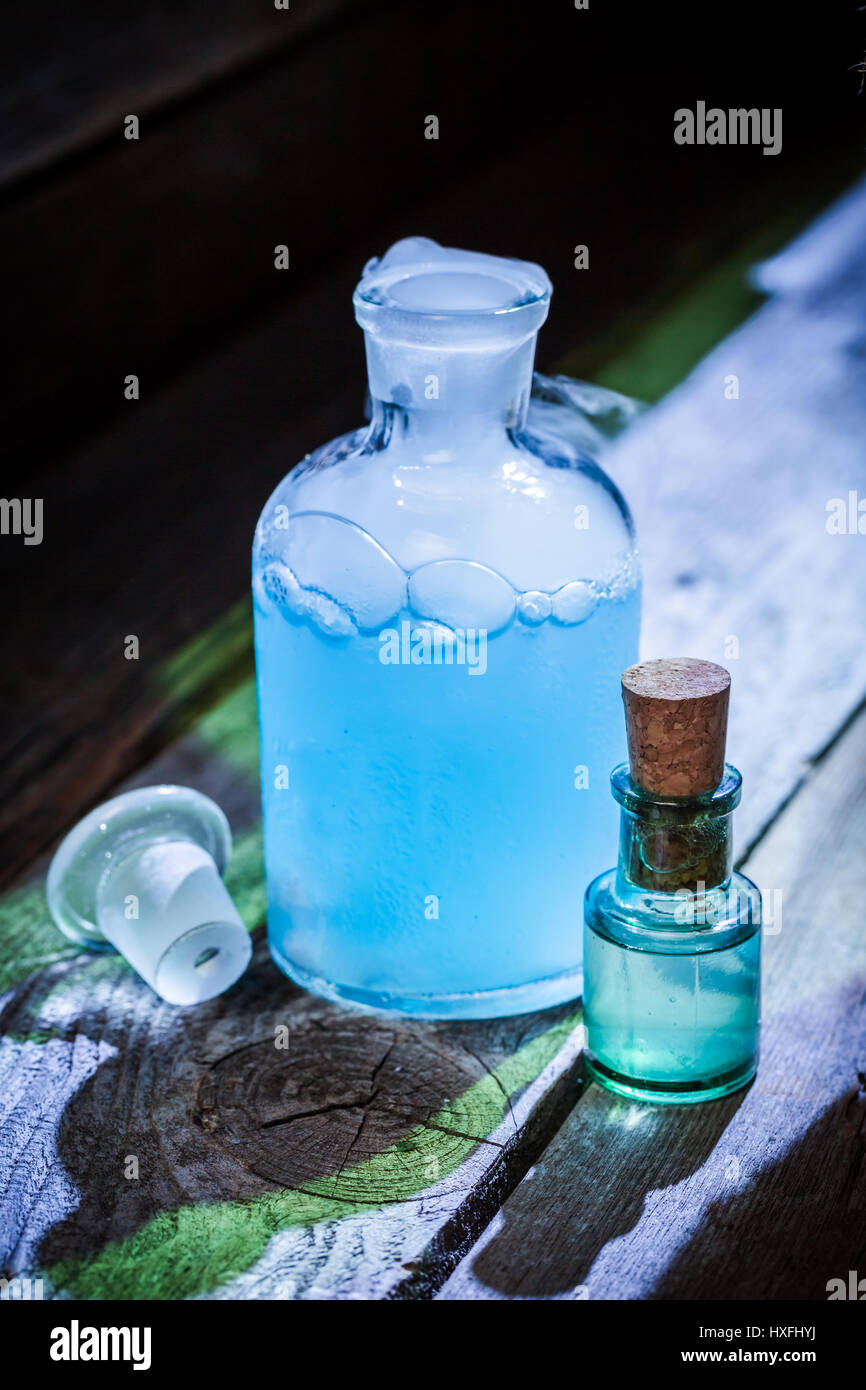 Magical blue potions in witch cottage for Halloween Stock Photo - Alamy