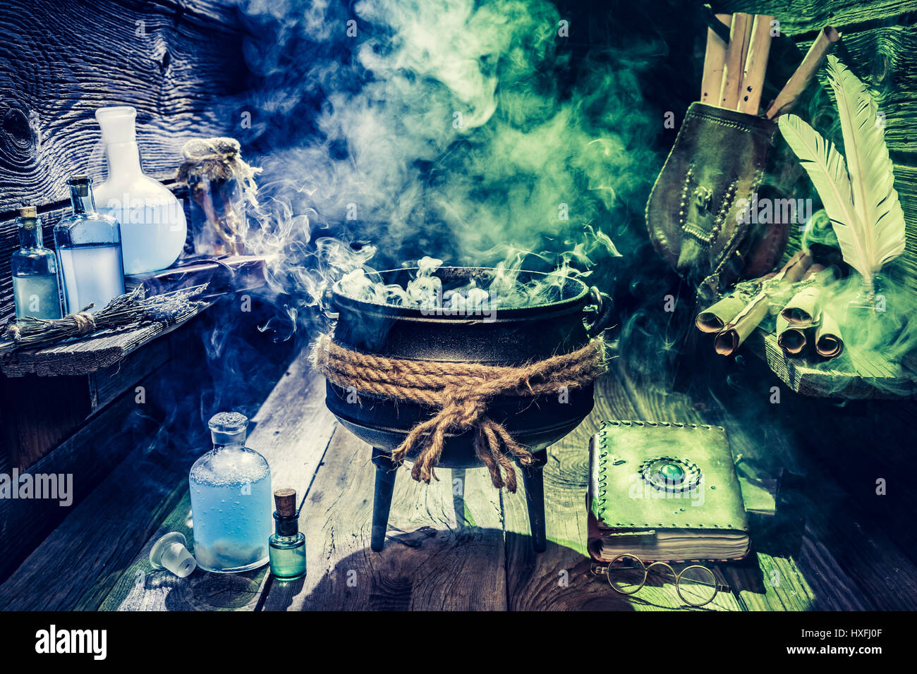 Full of magic mixture witch pot with blue potions Stock Photo - Alamy