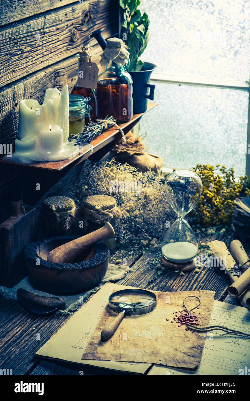 Scribe and witcher workshop with scrolls and ingredients Stock Photo ...