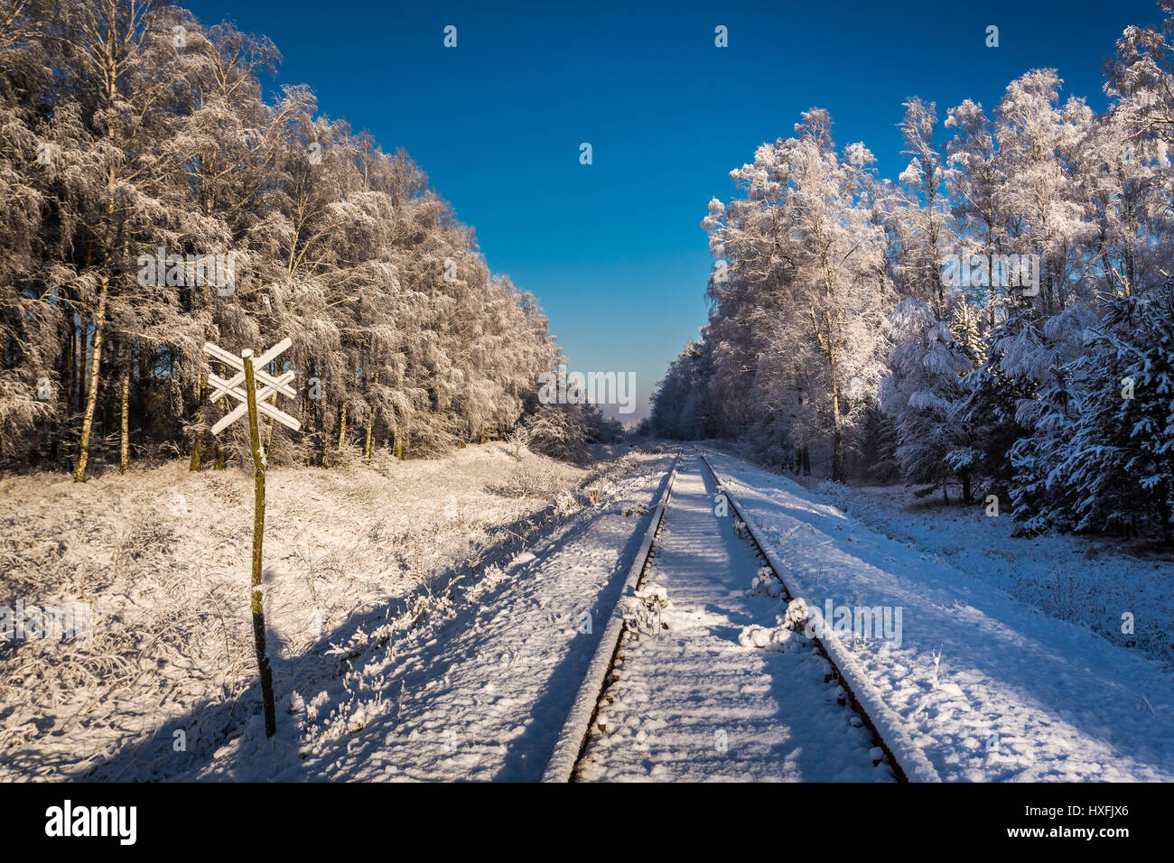Frozen unused railway line in winter at sunrise Stock Photo - Alamy