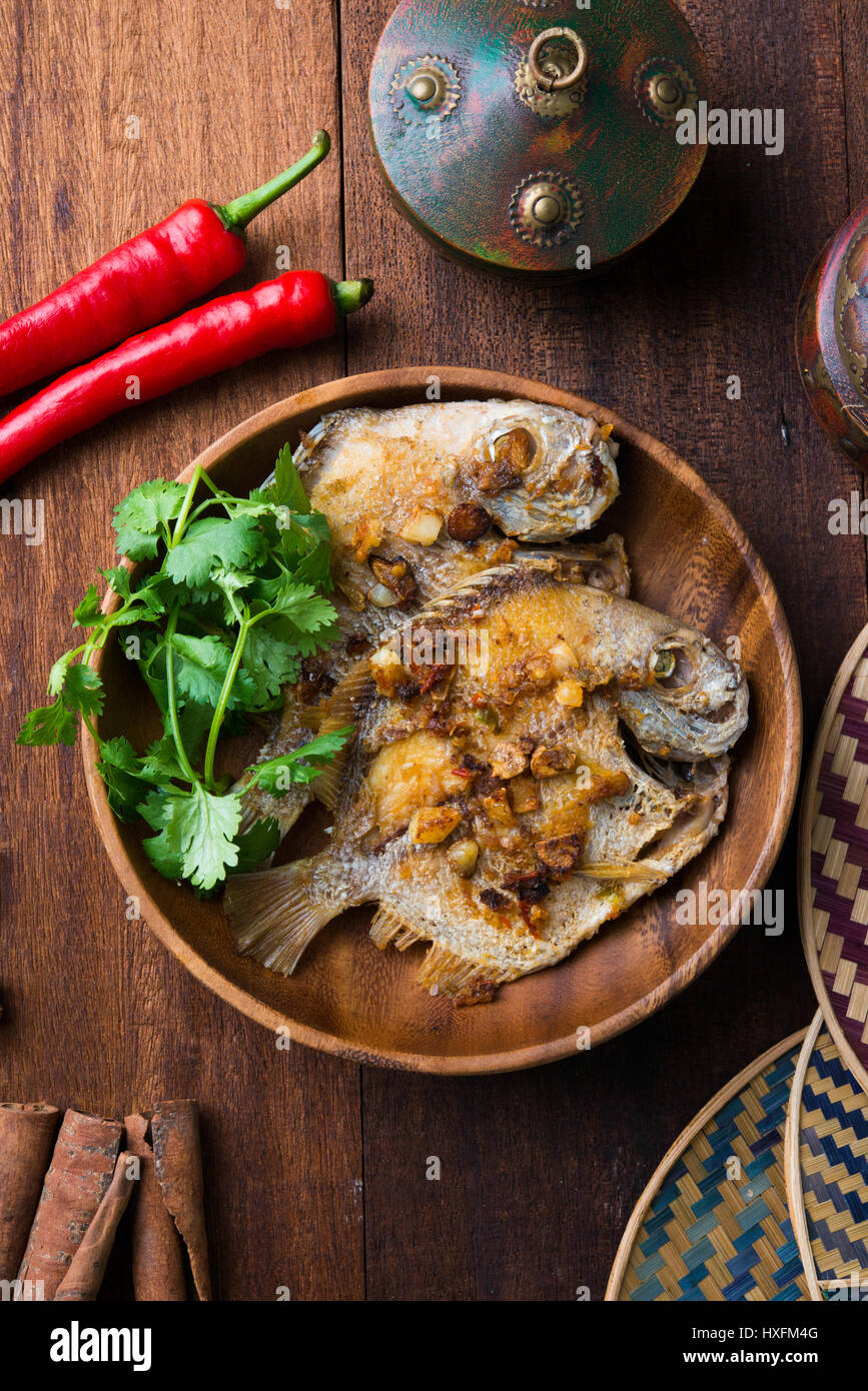 asian grilled fish top down view Stock Photo - Alamy