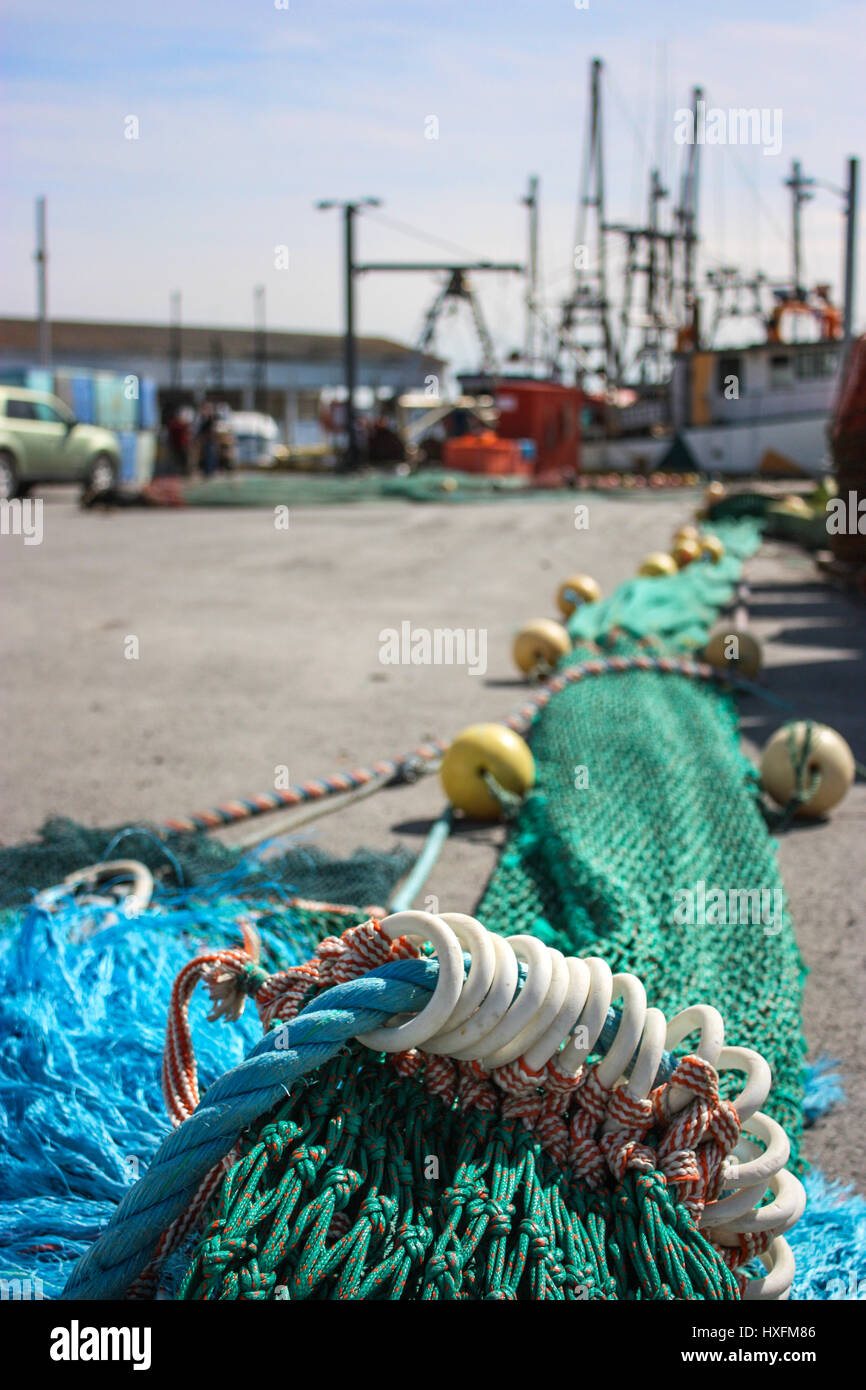 fishing nets and equipment at fishing port Stock Photo - Alamy