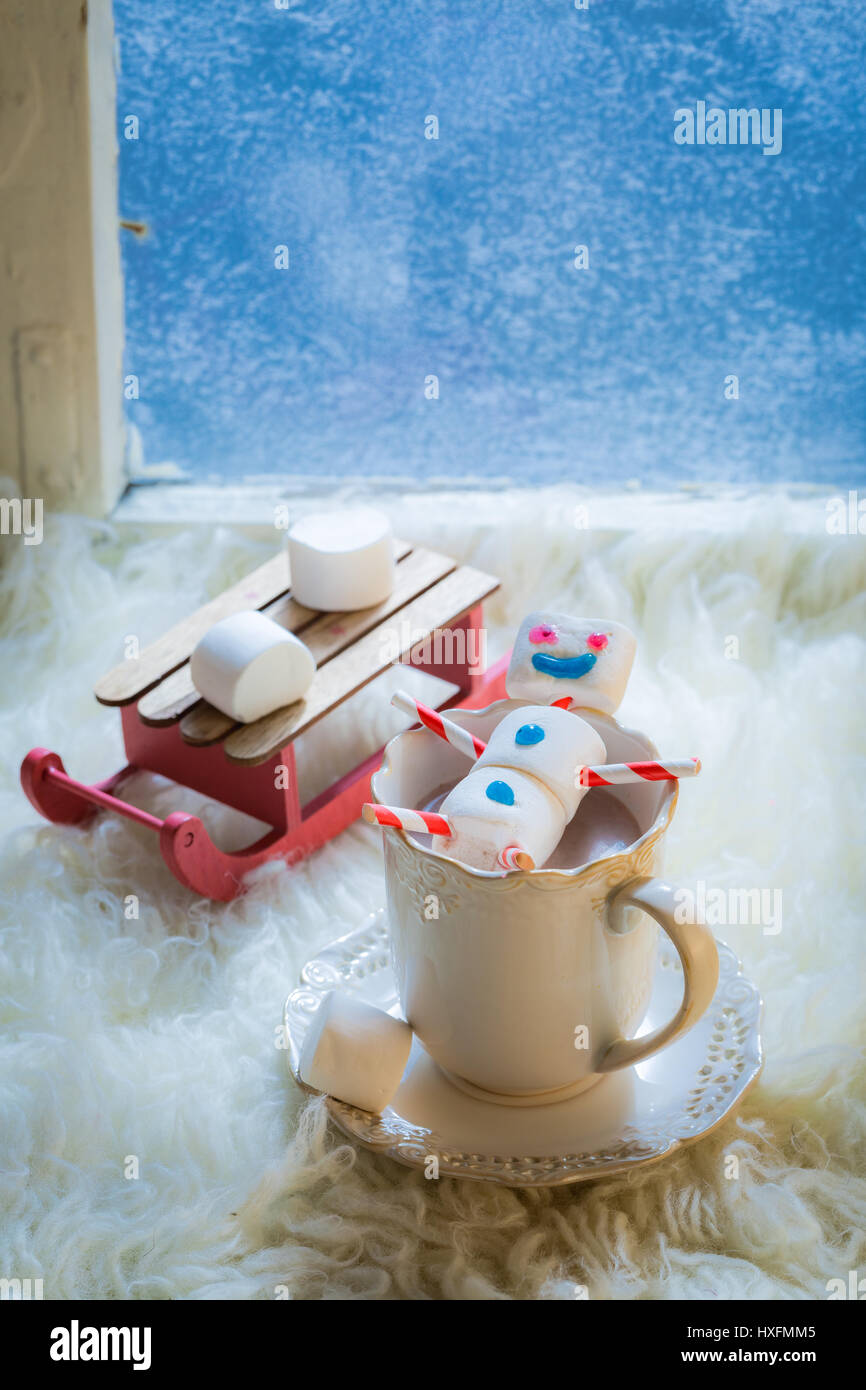 Melted in milk snowman for Christmas Stock Photo - Alamy