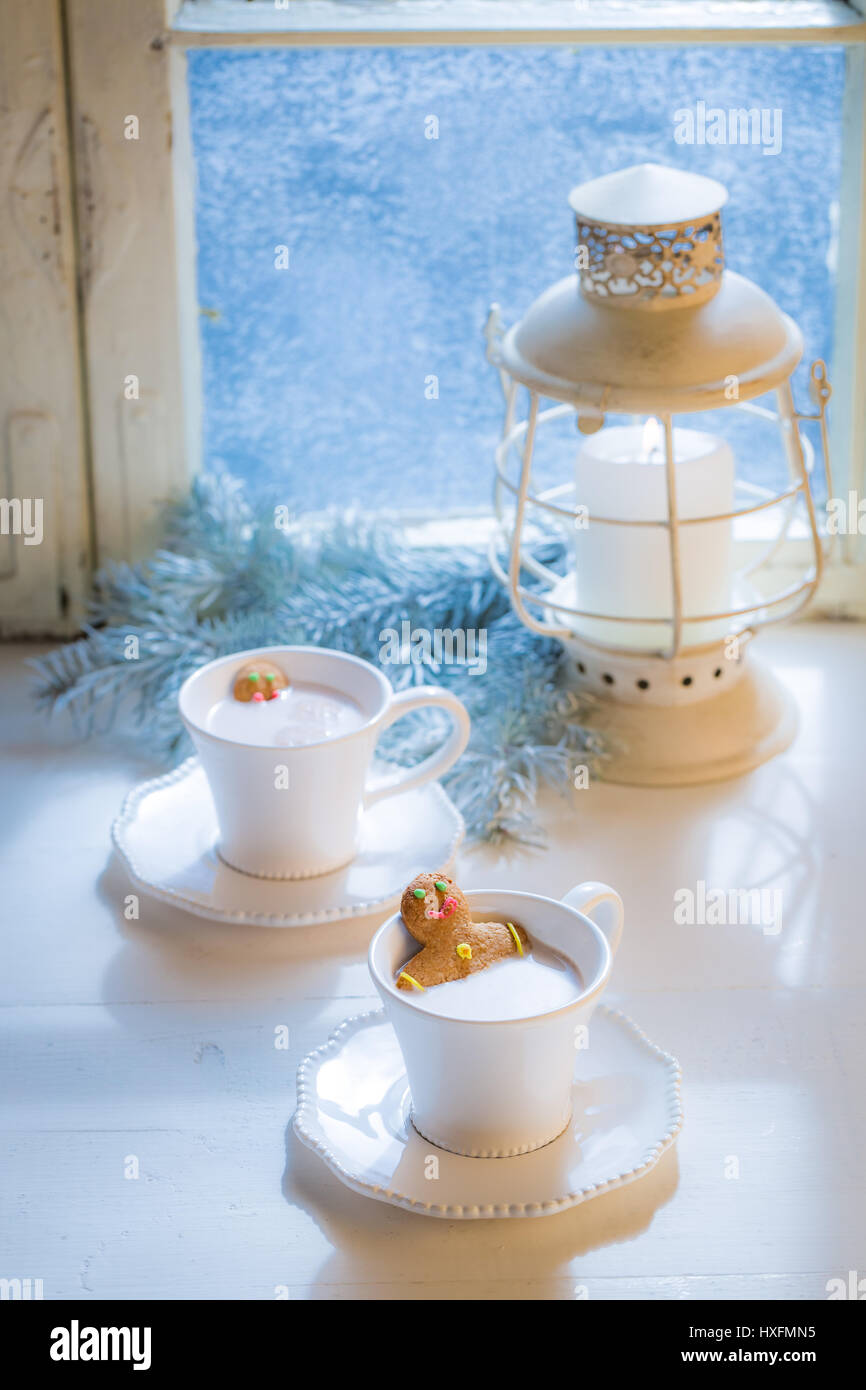 Relaxing in hot cocoa two gingerbread man for Christmas Stock Photo - Alamy