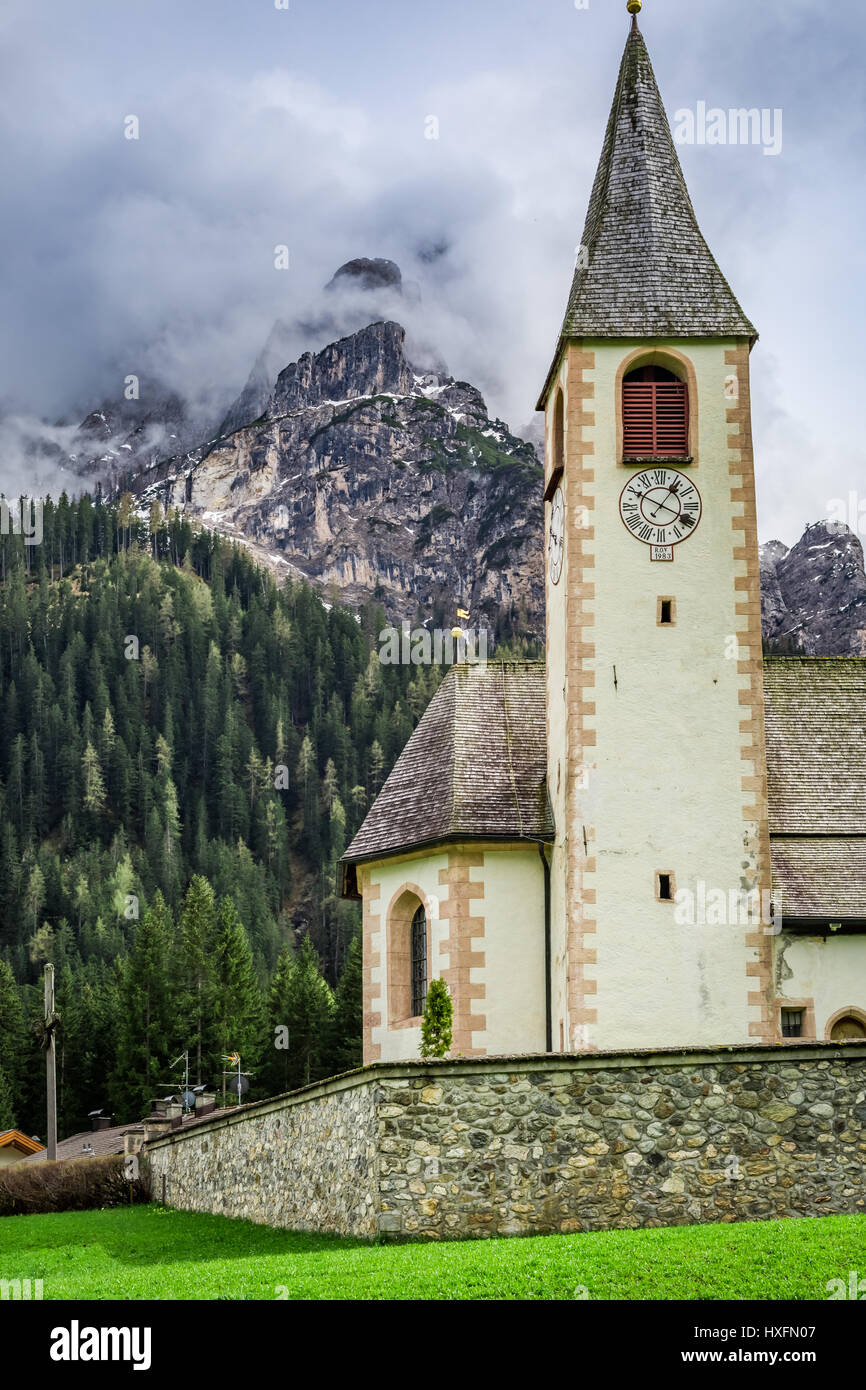 Small church in cloudy mountain Dolomites, Italy Stock Photo - Alamy