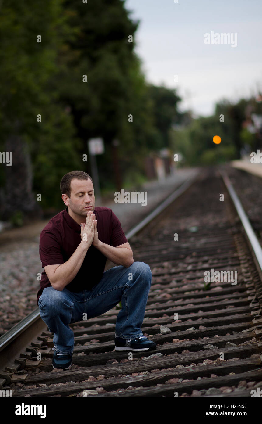 Man crouching crying hi-res stock photography and images - Alamy