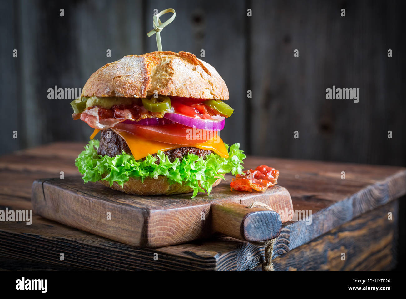 Spicy hamburger made of lettuce, beef and cheese Stock Photo - Alamy