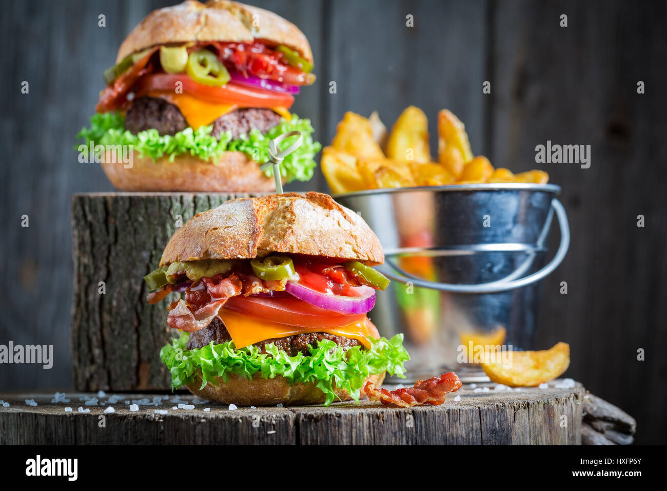 Spicy hamburger made of beef, cheese and vegetables Stock Photo - Alamy