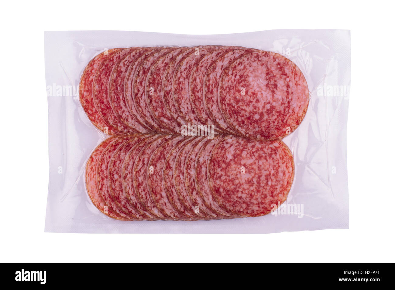 top view of smoked salami sausages slices in transparent vacuum plastic ...