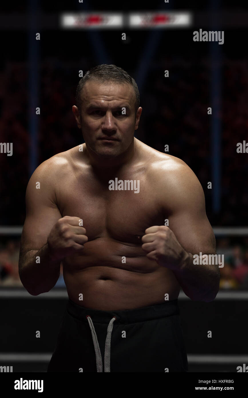 professional kickboxer with hands in martial arts position training for ...