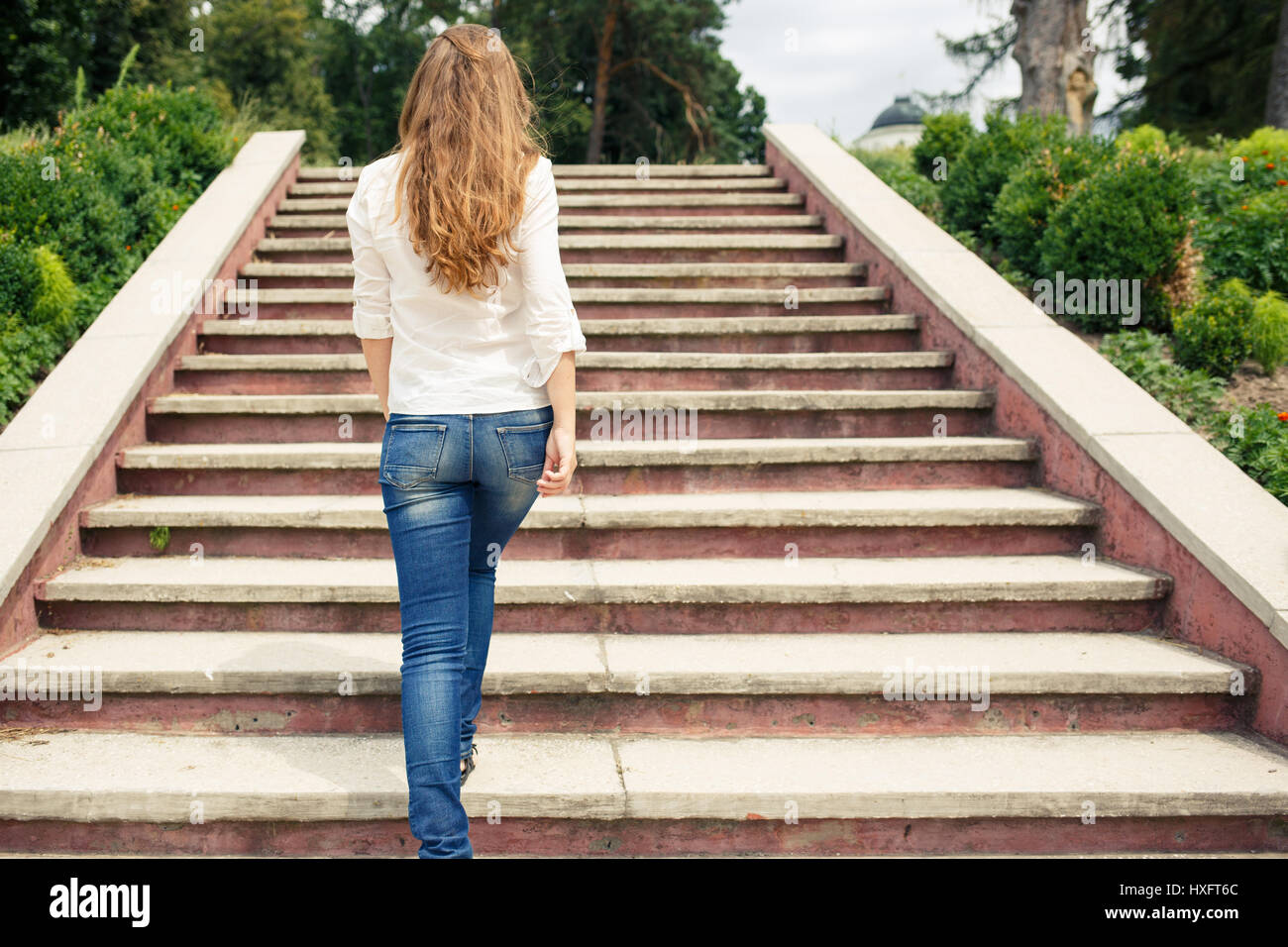 Stairs woman rear view hi-res stock photography and images - Alamy