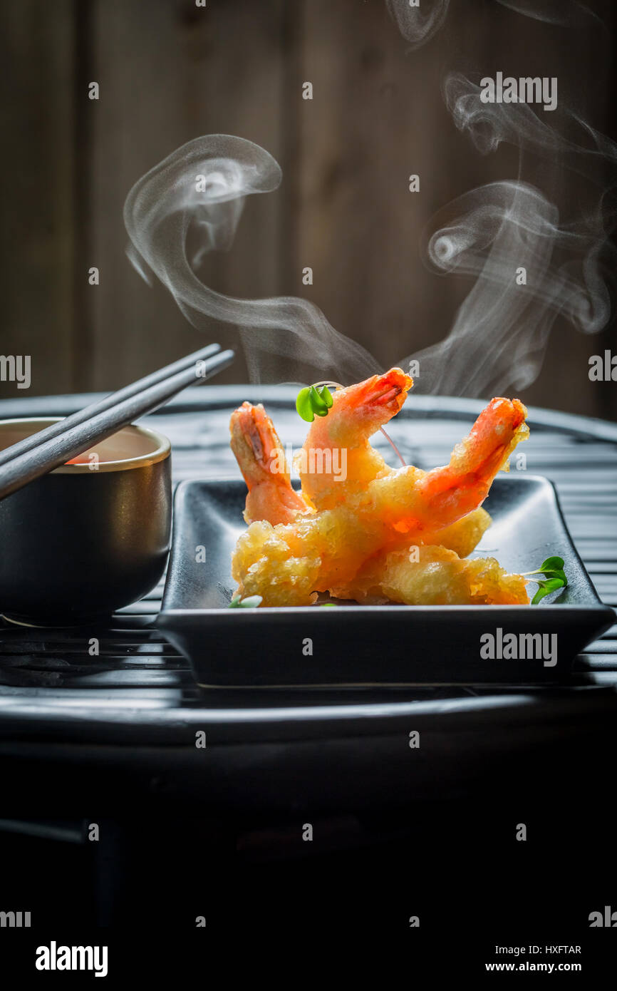 Golden shrimp in tempura with red sauce Stock Photo - Alamy