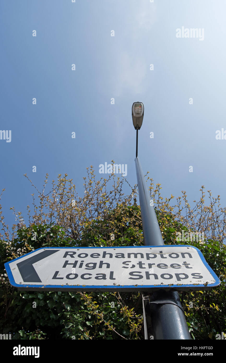 left pointing sign showing direction to roehampton high street and ...