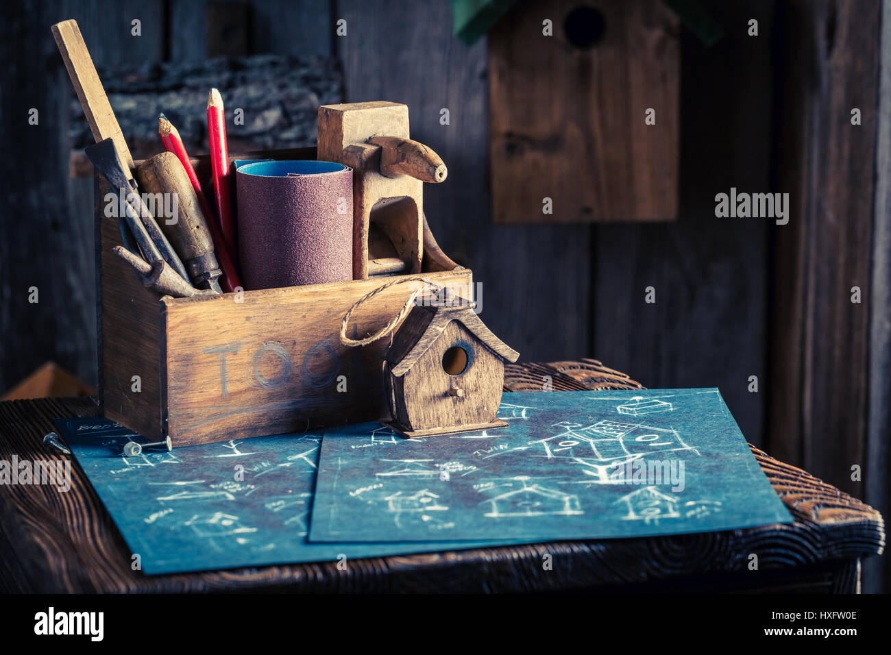 Cute small bird house and plan to build it Stock Photo - Alamy