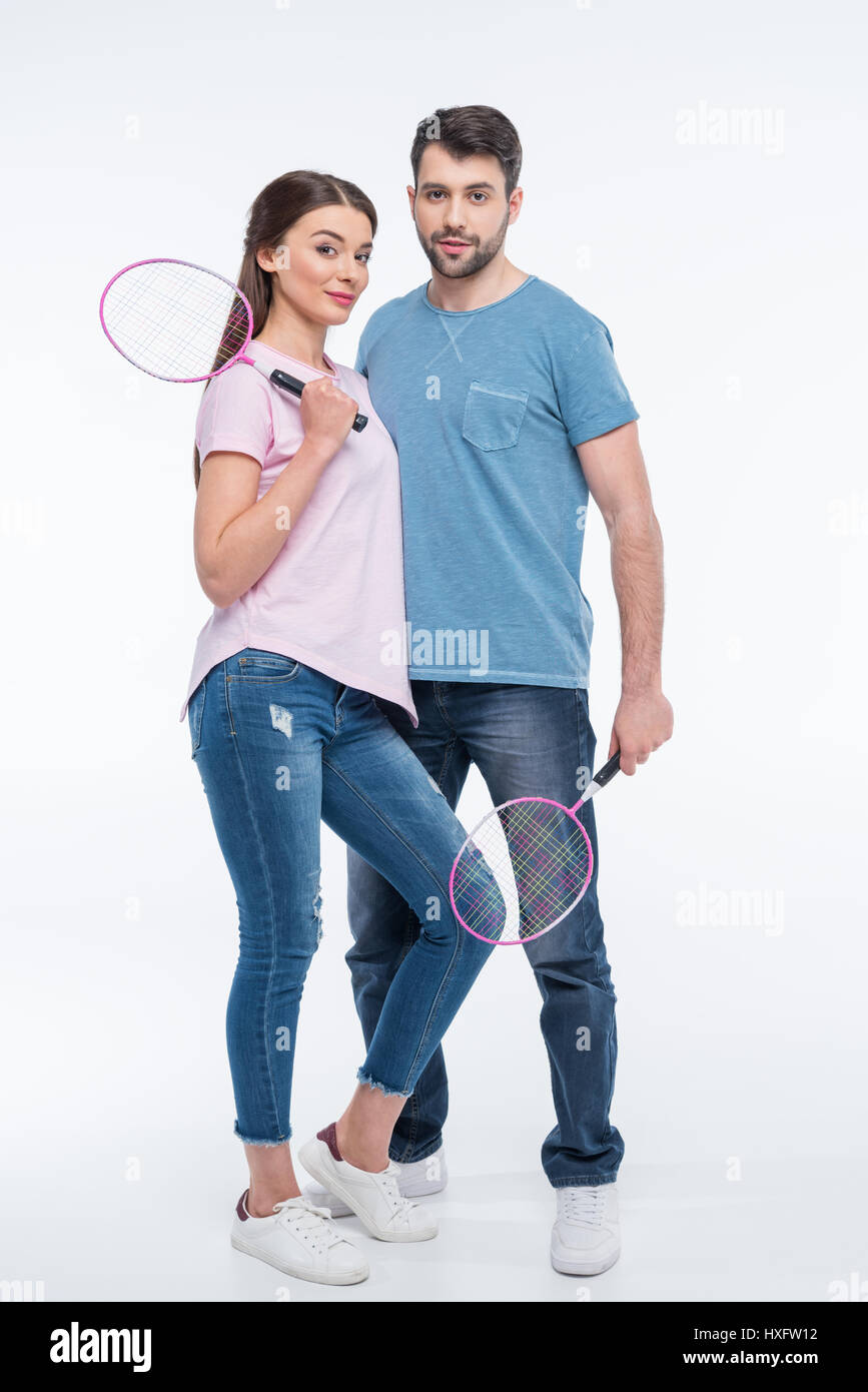 couple with badminton rackets in hands on white Stock Photo - Alamy