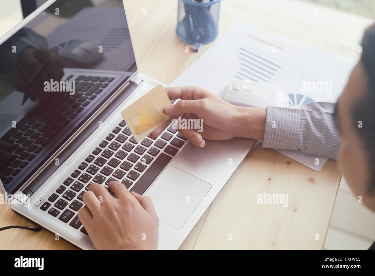 Businessman doing online banking, making a payment or purchasing goods ...