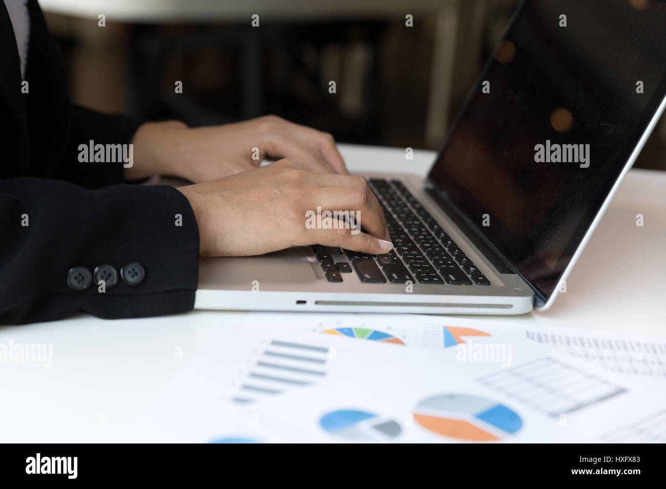 young business woman working in office interior on pc on desk, typing ...