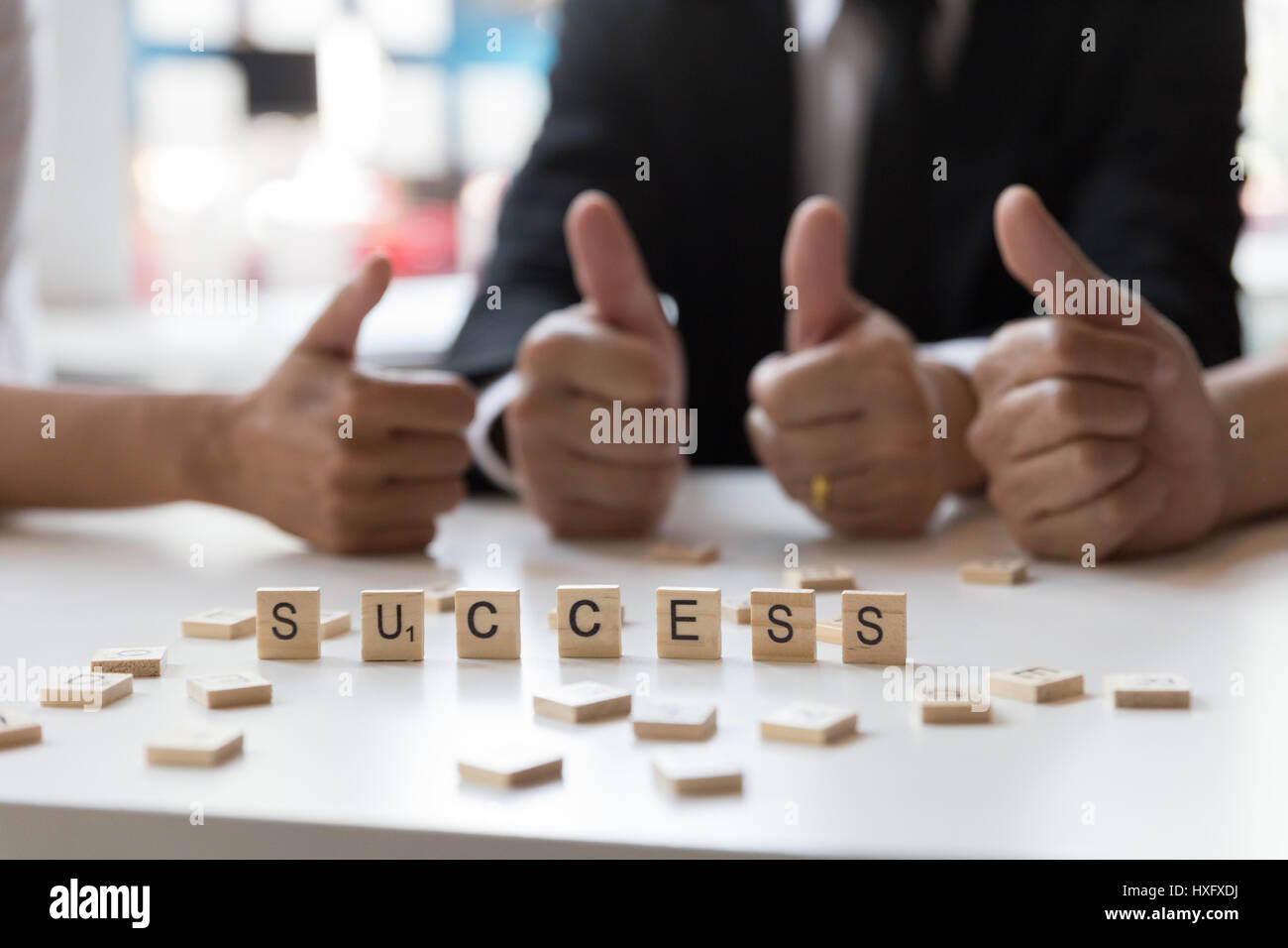 Word ''success'' on wooden letters blocks with business team group ...