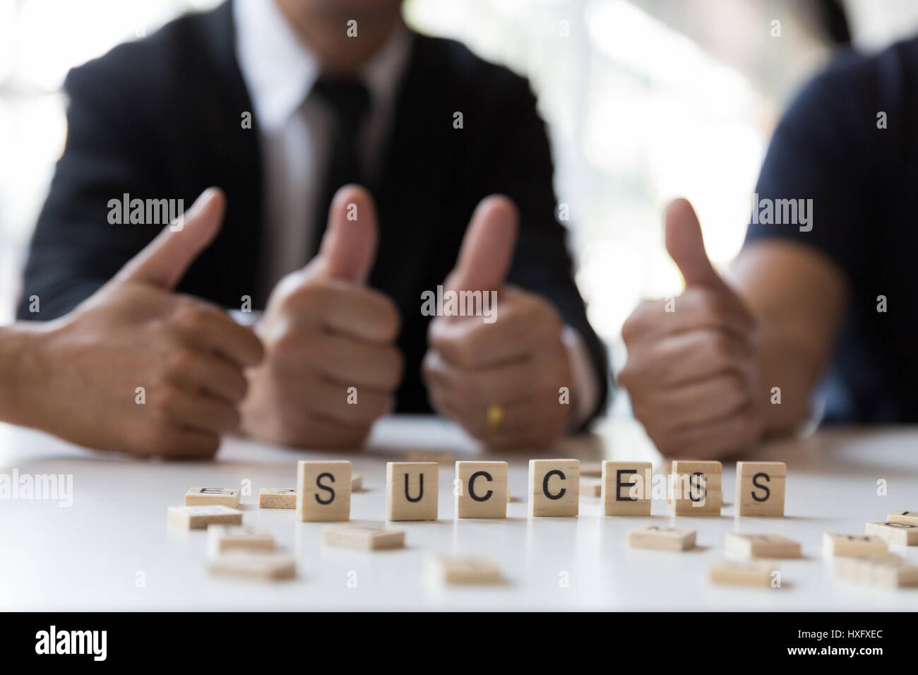 Word ''success'' on wooden letters blocks with business team group ...