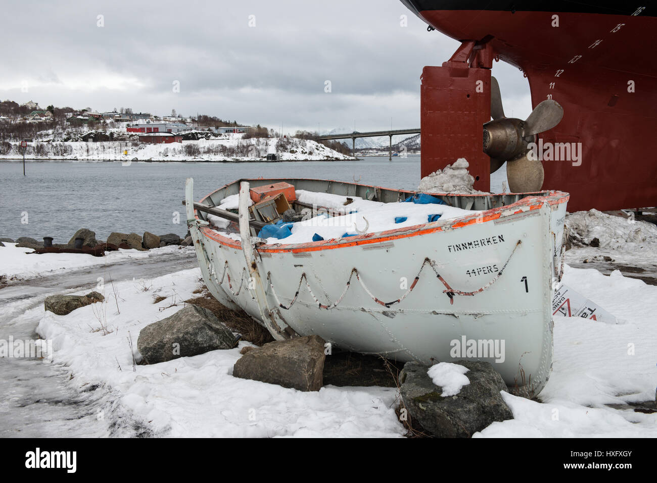 Old Hurtigruten life boat Finnmarken and stern of the original ship ...