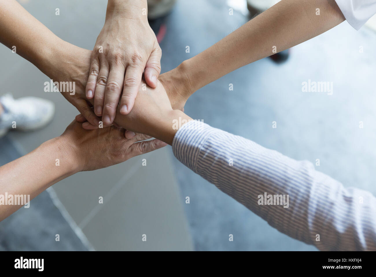 startup business team showing unity with their hands together Stock Photo - Alamy