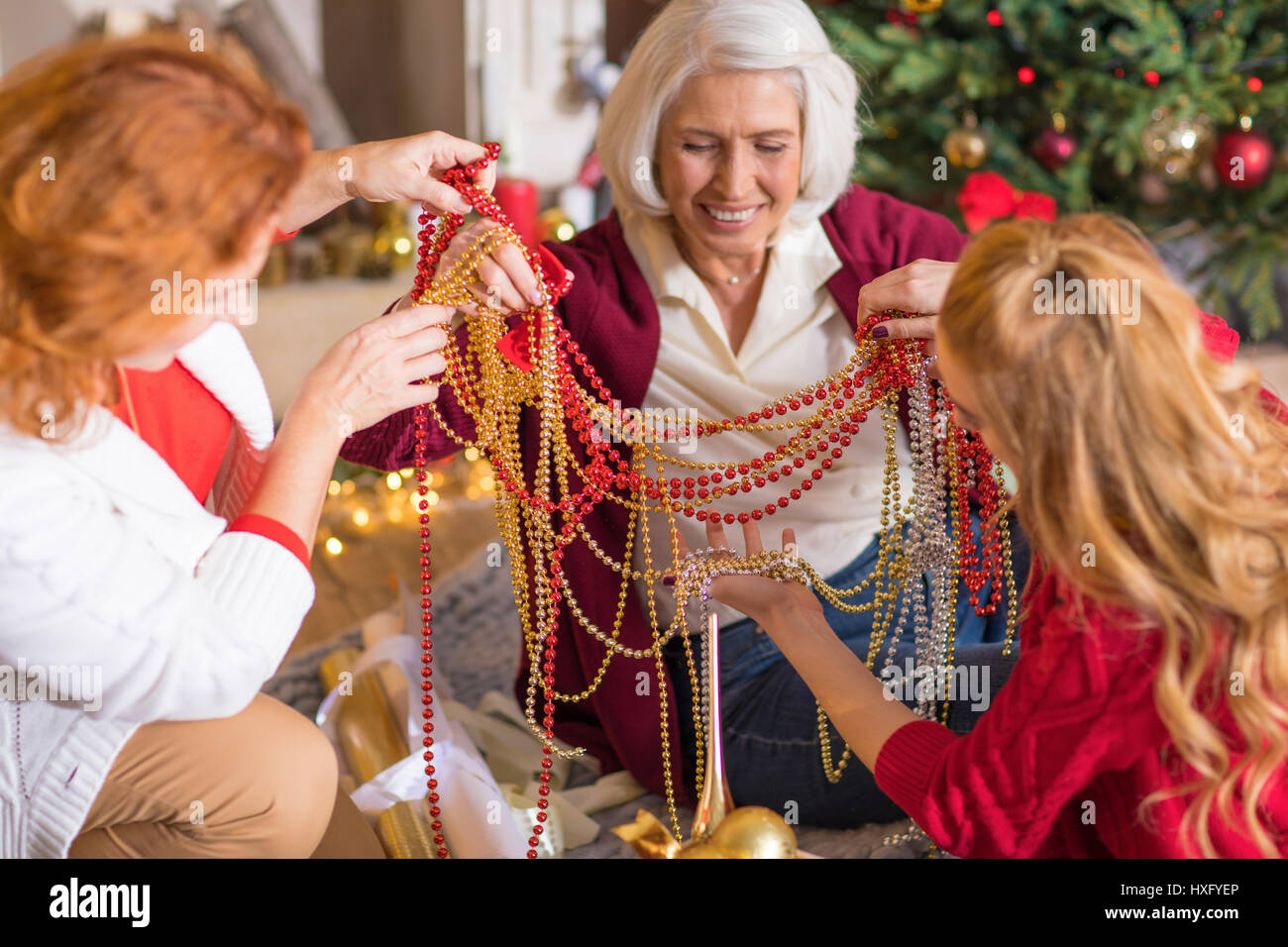 Happy family from three generations having fun with christmas ...
