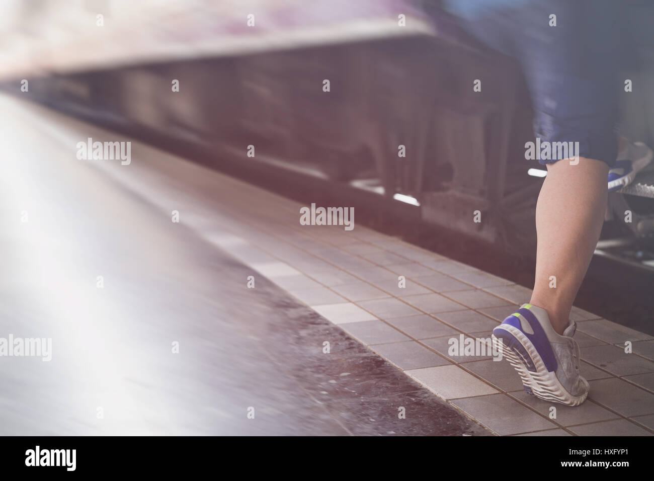 Traveler holding and stepping up to a train with backpack for journey ...