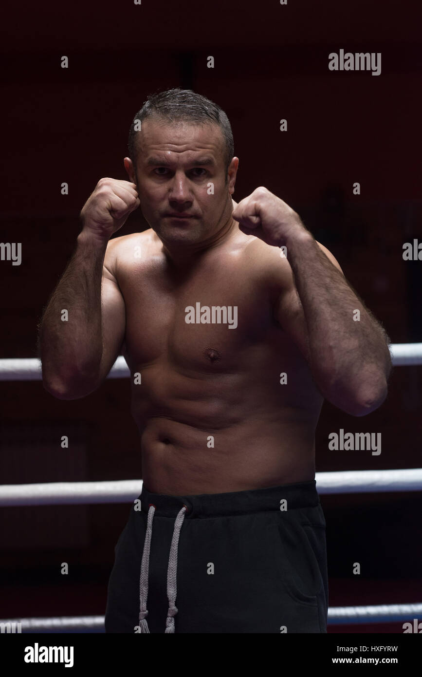 professional kickboxer with hands in martial arts position training for ...