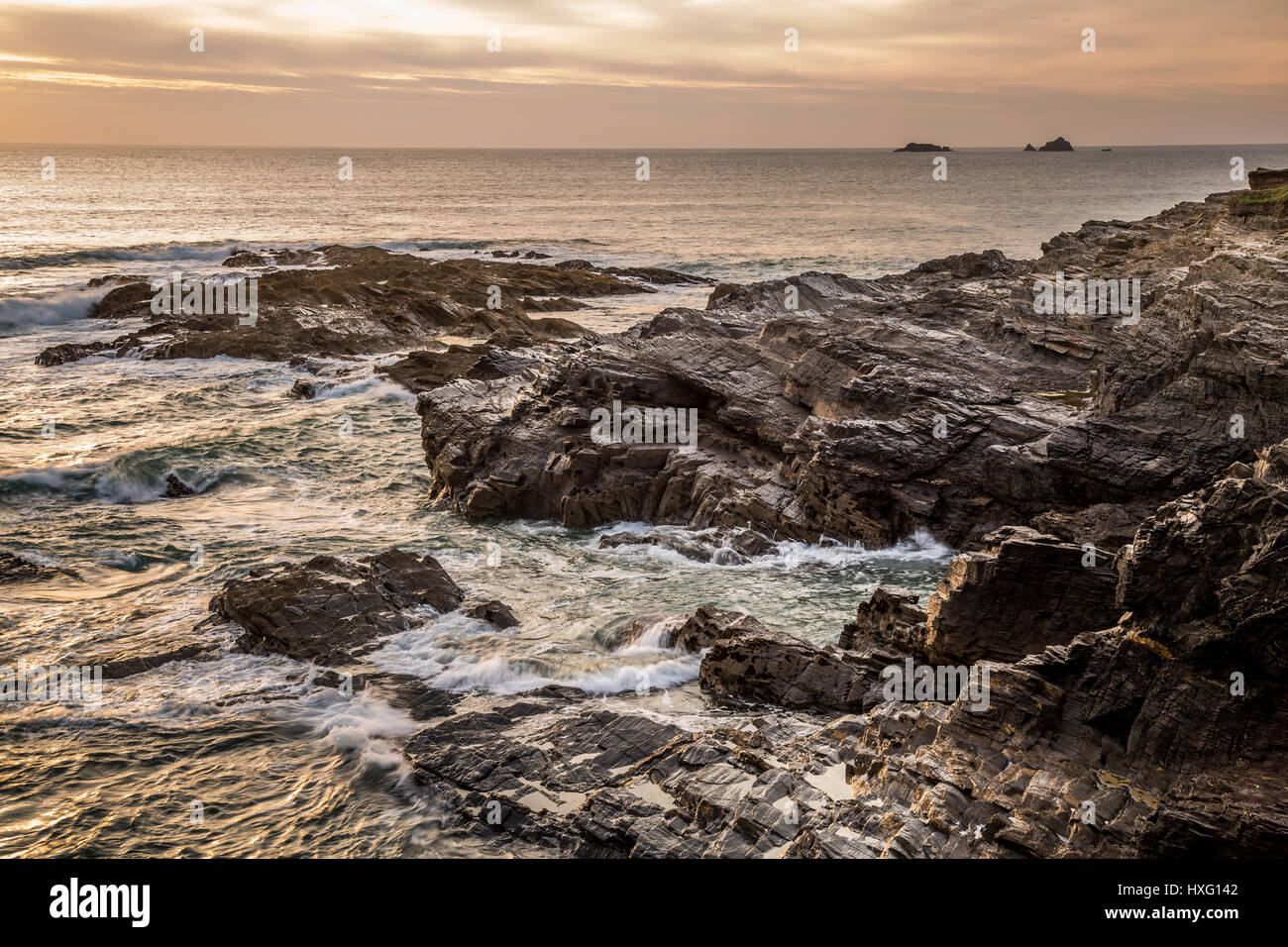 Orange glow of evening sunset at Treyarnon Bay, Cornwall. 2015 Stock ...
