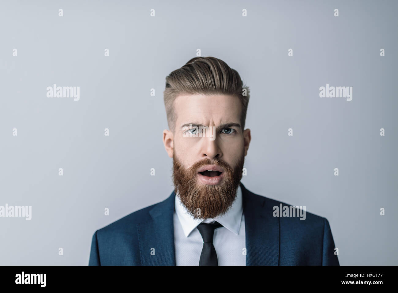 Shocked young businessman looking camera hi-res stock photography and ...