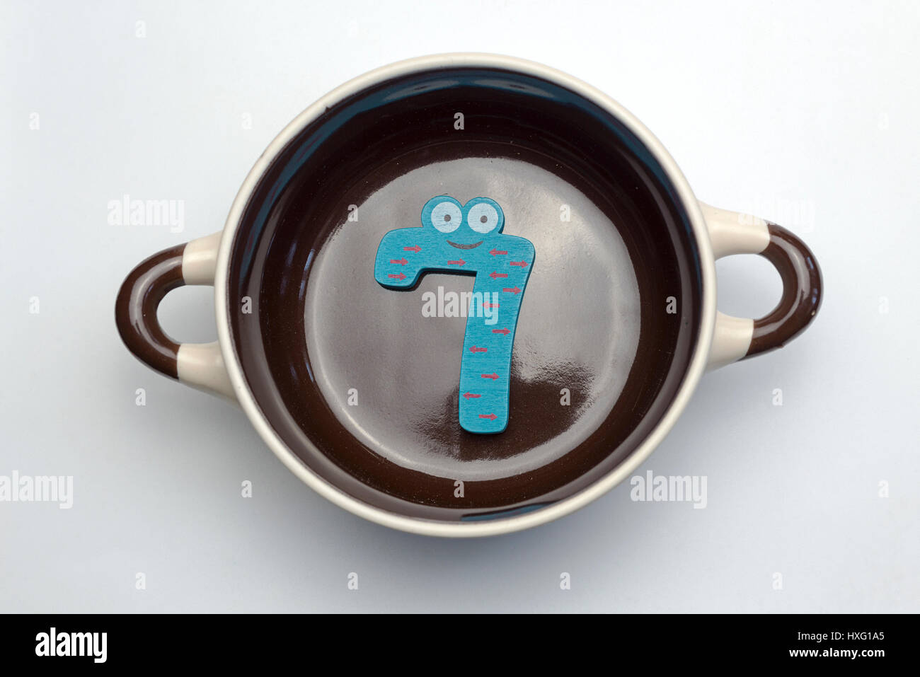 The number seven at the bottom of the soup tureen on white background ...