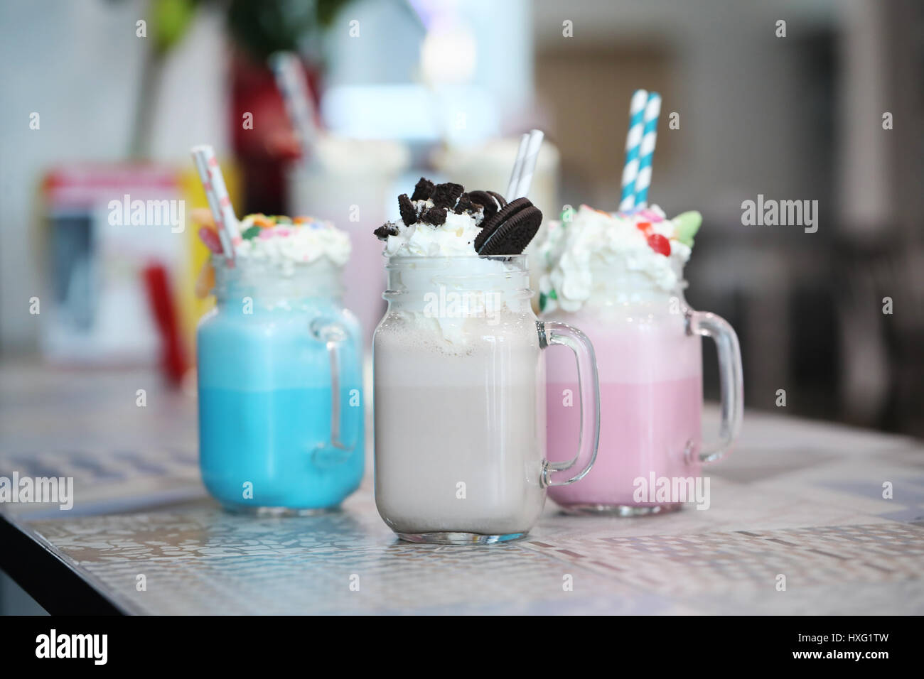 Glass pink milkshake decorated candy hi-res stock photography and ...