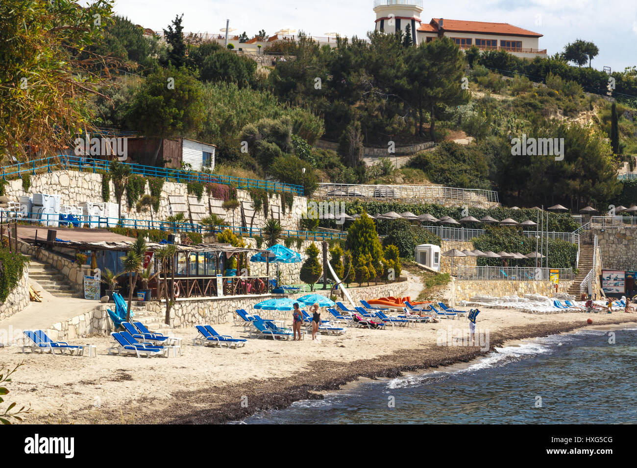 AYDIN, TURKEY - APRIL 30, 2016 : View of a sandy beach with sunbeds and ...