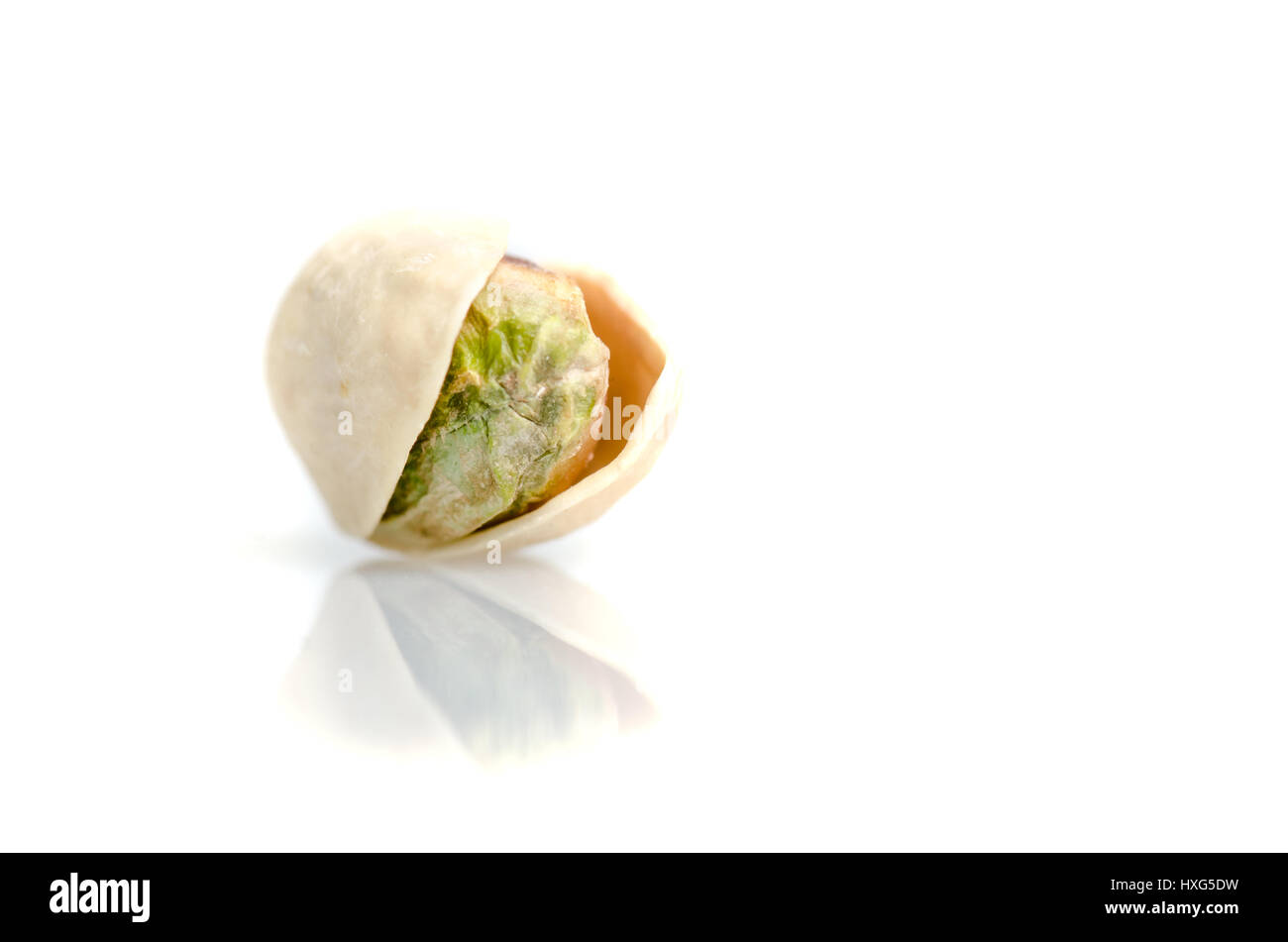 Single pistachio in shell isolated on white background Stock Photo - Alamy